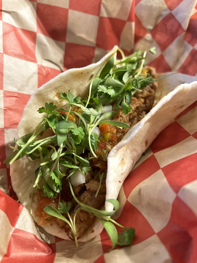 Not your average taco Tuesday contender – this pulled pork taco with fresh cilantro is what happens when Colorado meets Texas and they become best friends.