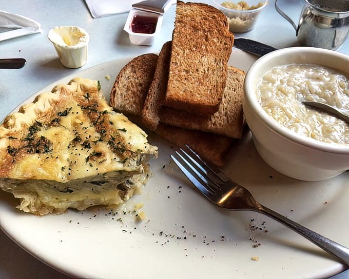 This isn't just breakfast—it's architecture. Layers of egg, herbs, and cheese alongside grits that would make any Southerner nod in approval.
