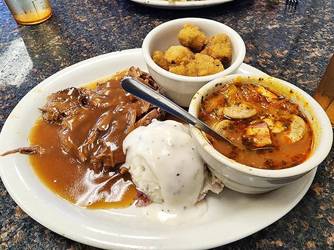 Pot roast that doesn't need a fancy introduction—just a hungry audience. Those mashed potatoes wearing a gravy hat are the supporting actors who steal the show.