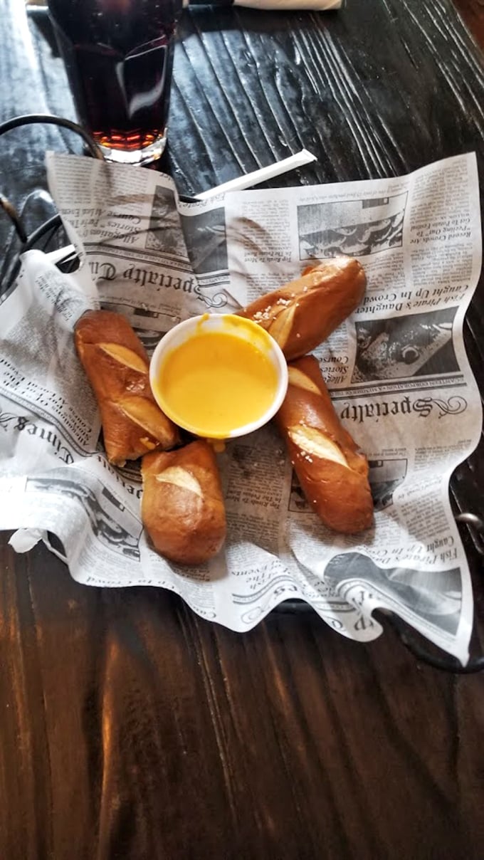 Pretzel perfection with cheese sauce that glows like liquid gold—carbs have never looked this good in newspaper.