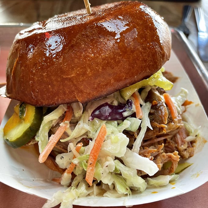 A pulled pork sandwich that doesn't hide behind gimmicks – just honest BBQ topped with fresh slaw on a bun that means business.