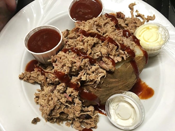 BBQ pulled pork atop a baked potato—proof that when two comfort foods fall in love, beautiful things happen on your plate.