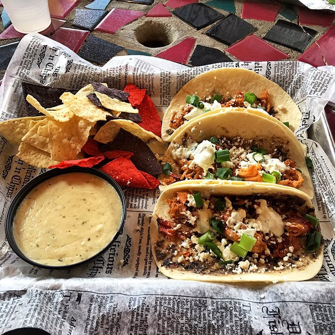 Tacos reimagined: pulled pork, fresh toppings, and a newspaper liner that might be the only news worth reading today.