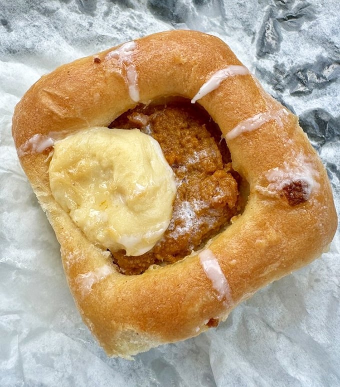 The pumpkin cream cheese kolache – where fall comfort meets Czech tradition in a pillowy package that makes pumpkin spice lattes look basic.