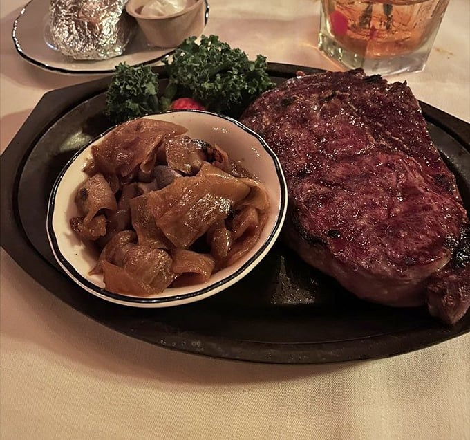 This rib eye arrives with perfectly sautéed mushrooms, proving Pinewood understands the sacred bond between steak and fungi.