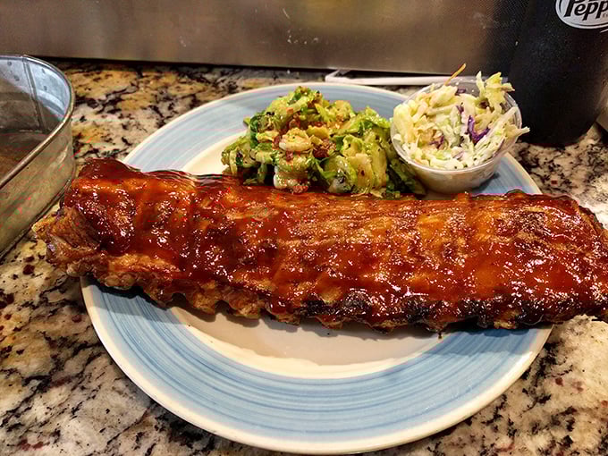 Even the ribs at this seafood joint demand respect—glistening, lacquered with sauce, and falling off the bone like they're auditioning for a food commercial.