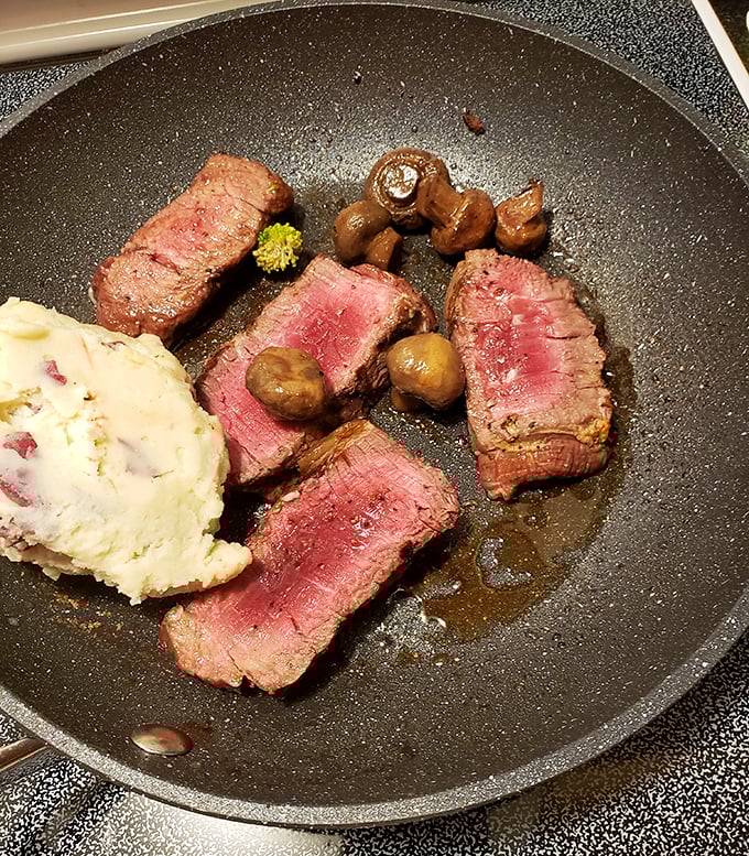 Tender slices of roast beef with mushrooms and mashed potatoes—comfort food that gives you permission to unbutton your pants.