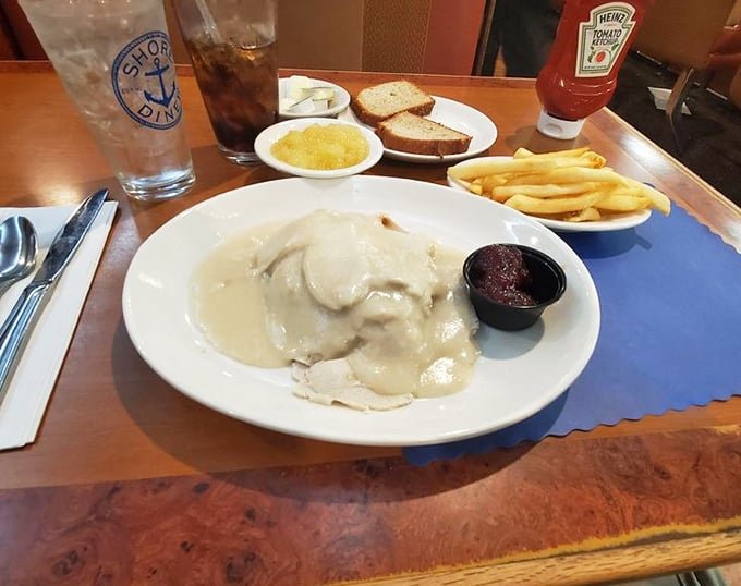 Turkey dinner that doesn't wait for Thanksgiving, smothered in gravy so good you'll want to baptize your fries in it too.