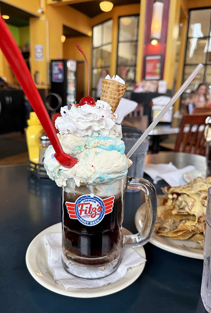 The root beer float that time forgot—a towering masterpiece of ice cream, whipped cream, and fizzy goodness that defies both gravity and restraint.