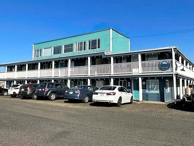 The Sand Dollar Condos offer that perfect coastal color palette—seafoam green with white trim—like the ocean decided to try its hand at architecture.