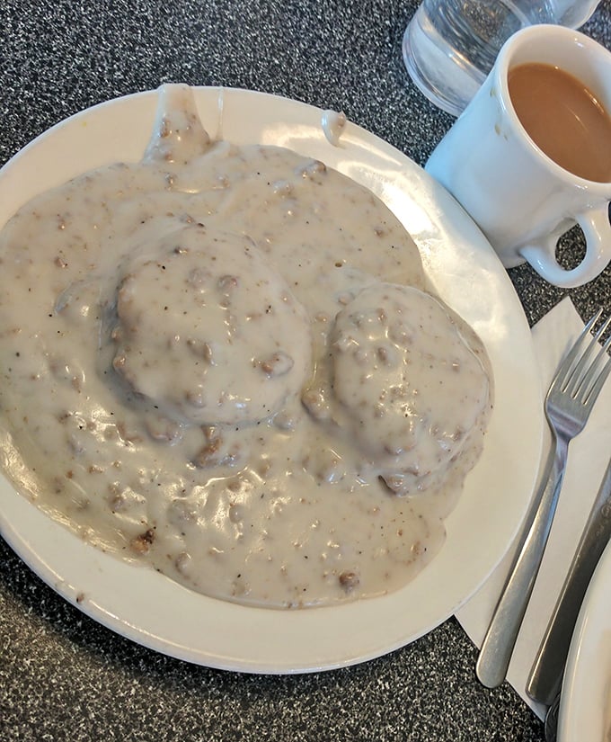 Sausage gravy blankets these biscuits like a warm Pennsylvania snowfall—comforting, generous, and guaranteed to make you forget about any diet resolutions.