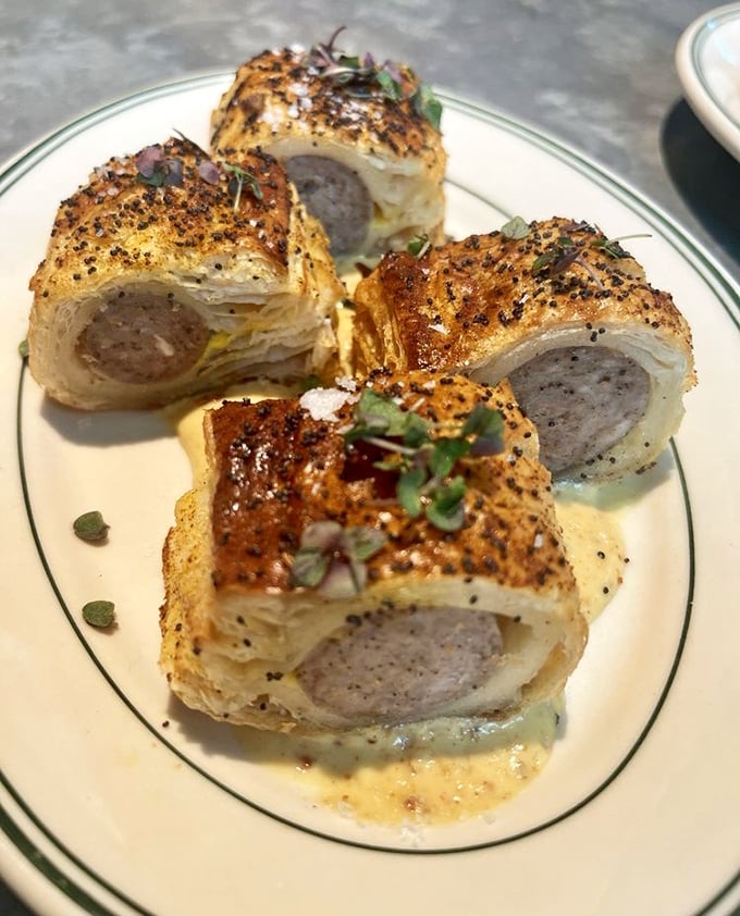 Sausage rolls wrapped in flaky pastry—like pigs in blankets that went to Oxford and came back with a fancy degree.