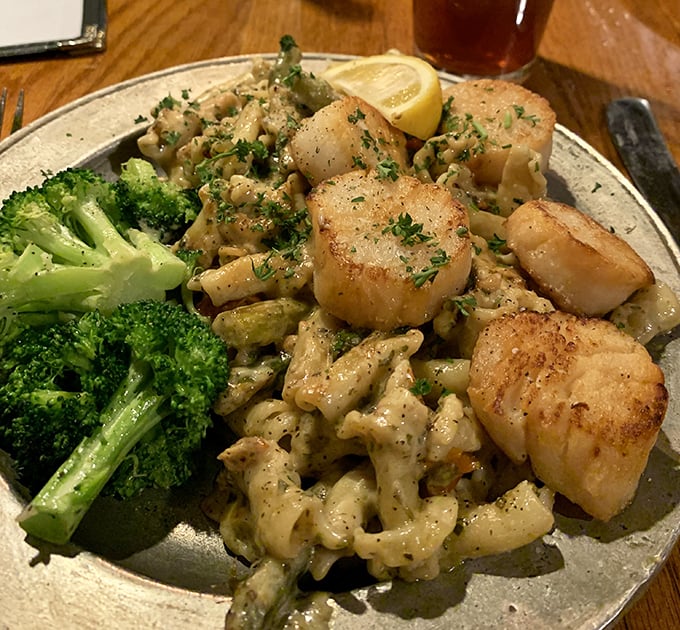 Perfectly seared scallops nestled among pasta like culinary jewels—proof that seafood in Pennsylvania can rival coastal offerings any day of the week.