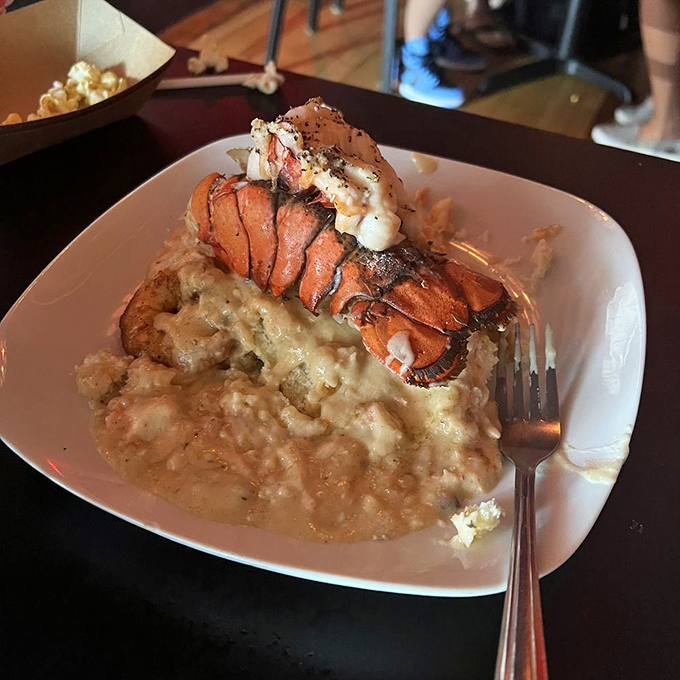 This isn't just seafood—it's a coastal romance story told through butter-poached lobster tail and creamy grits. A dish worth committing to memory.
