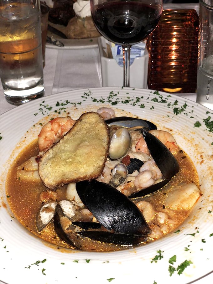 San Francisco's famous cioppino – a seafood symphony where mussels, prawns, and fish swim in a broth worth drinking straight from the bowl.