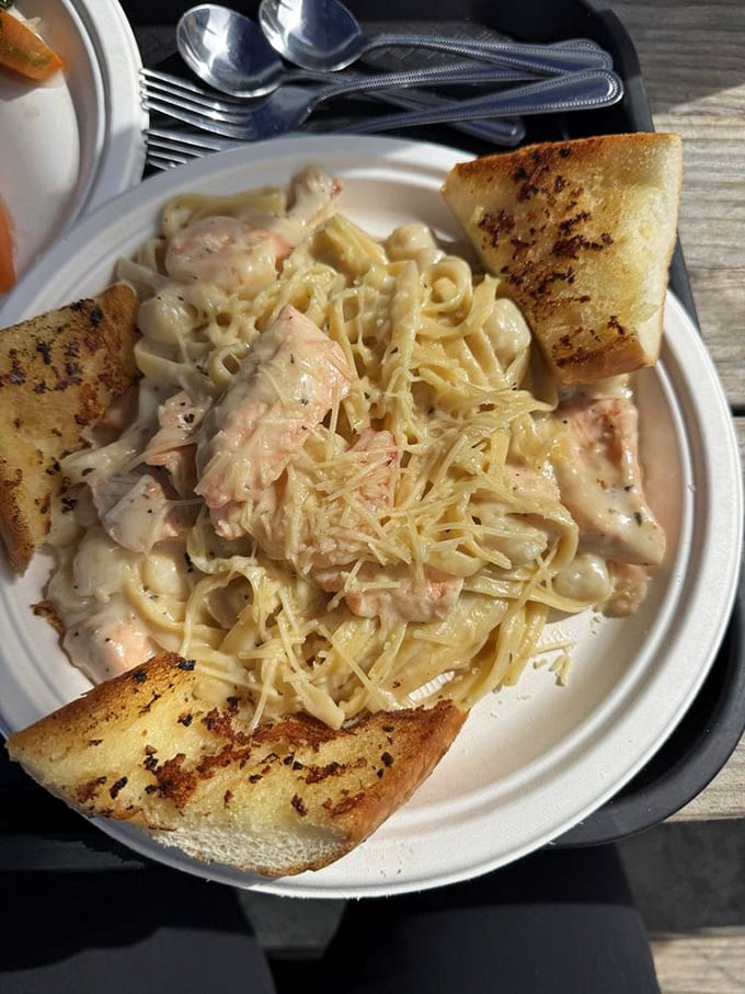 Seafood pasta that makes you question why anyone bothers with meat sauce. Those chunks of fish aren't hiding—they're showing off.