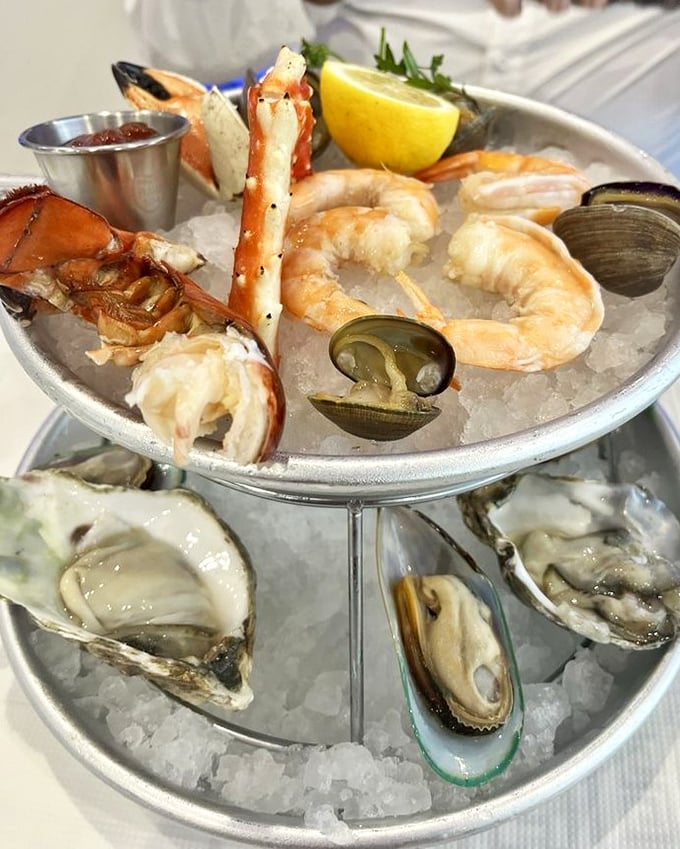 The seafood tower—where the ocean's bounty is displayed with all the subtlety of a Vegas showgirl. Decadence on ice.