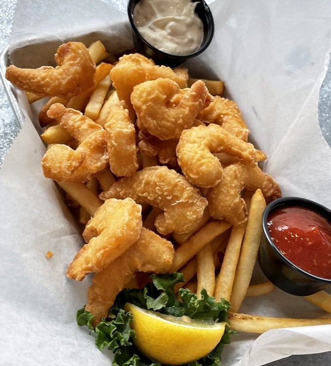 Crispy, golden shrimp perched atop fries—comfort food that's been to finishing school. The perfect marriage of casual and gourmet that defines JP's approach.