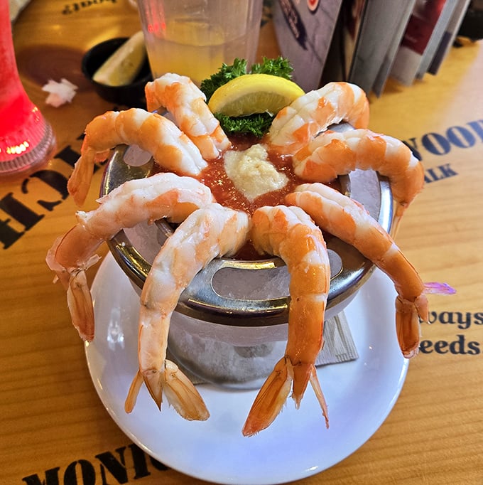 Shrimp cocktail arranged like a sunburst around sauce—proof that sometimes the simplest presentations create the most dramatic entrances.