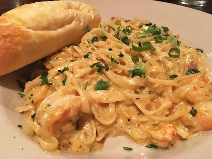 Fettuccine swimming in creamy sauce with shrimp and crawfish – pasta that makes you forget Italy exists for a delicious Louisiana minute.