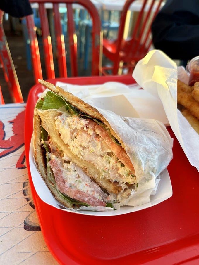 Crab sandwich architecture at its finest – layers of sweet Dungeness meat nestled between bread that's merely a delivery system.