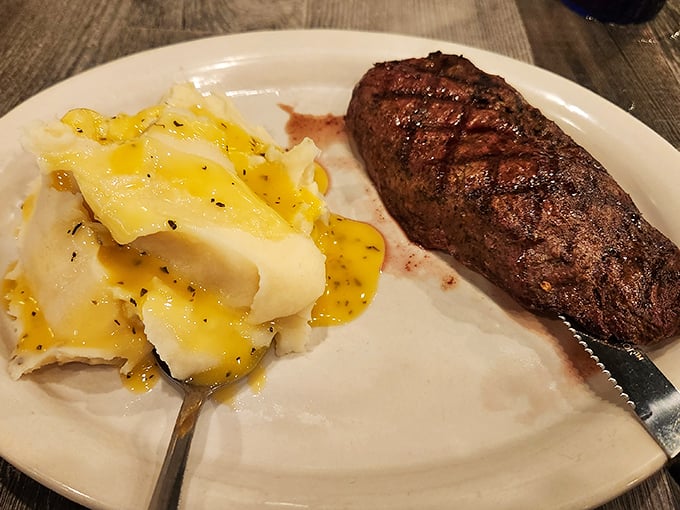 A perfectly grilled sirloin with buttery mashed potatoes – proof that sometimes the simplest pleasures are the most profound.