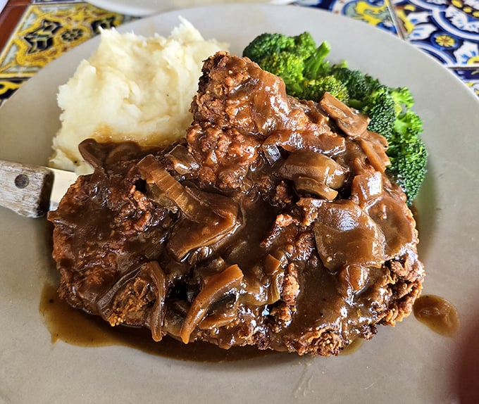 The chicken fried steak that launched a thousand naps – golden-crisp exterior, tender interior, and gravy that should be considered a controlled substance.