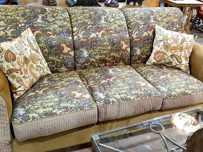 That sofa has seen things – specifically the 1980s – but with those throw pillows, it's ready for its comeback tour.