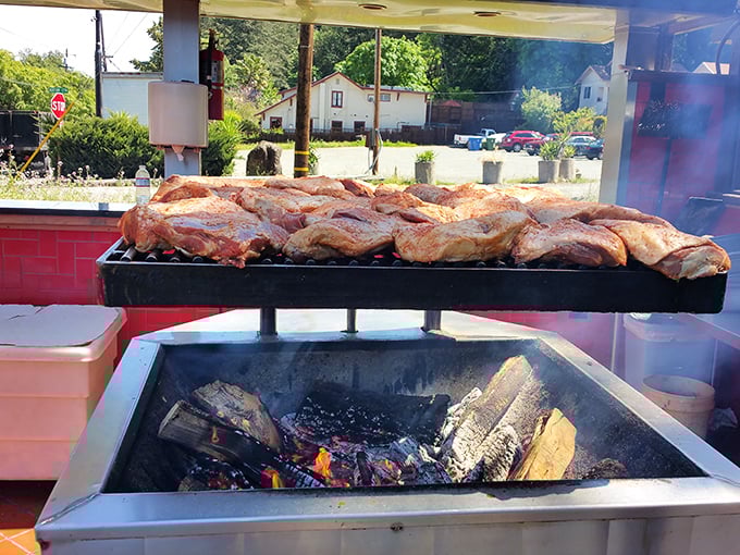 The outdoor smoker—where magic happens over open flame. If heaven has a scent, it probably smells exactly like this.