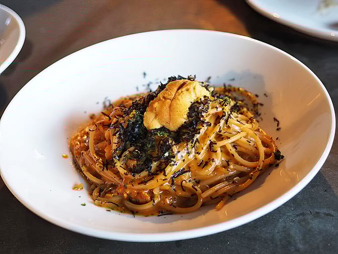 The legendary spaghetti rustichella topped with sea urchin—pasta alchemy that transforms simple strands into gold through the magic of umami.