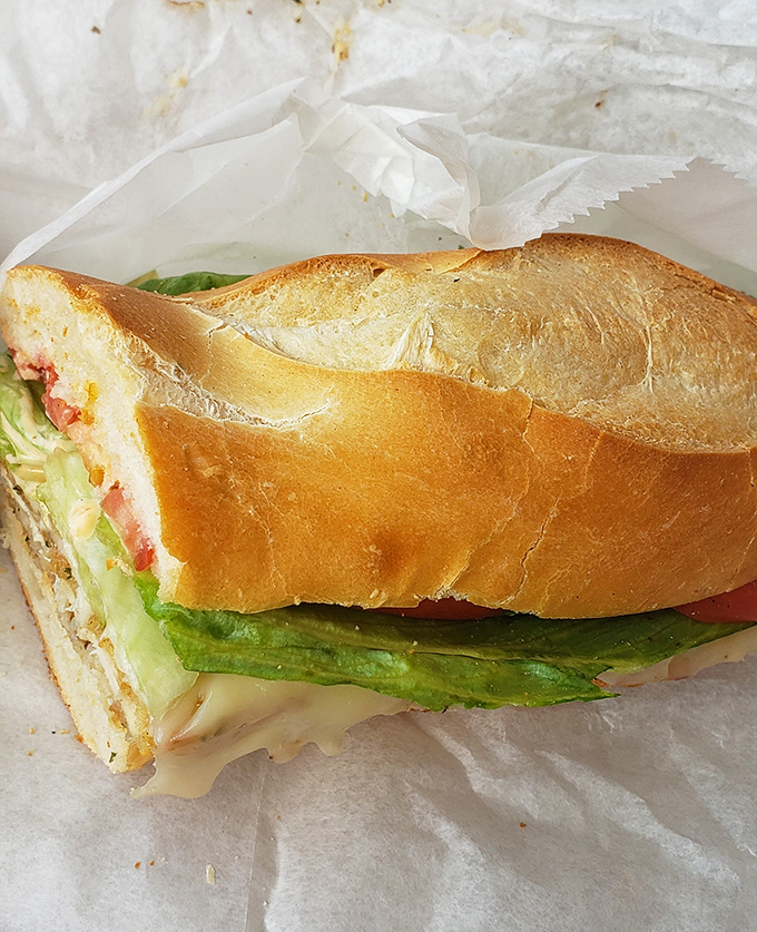 This isn't just a sandwich—it's a masterclass in texture and balance. Crisp bread, fresh veggies, and savory fillings create the holy trinity of lunch.