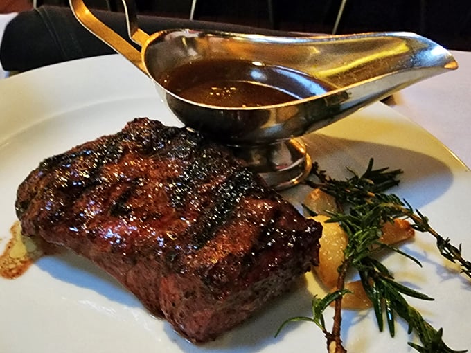 A perfectly seared steak with a sauce boat nearby—like having a life raft when you're already in heaven.