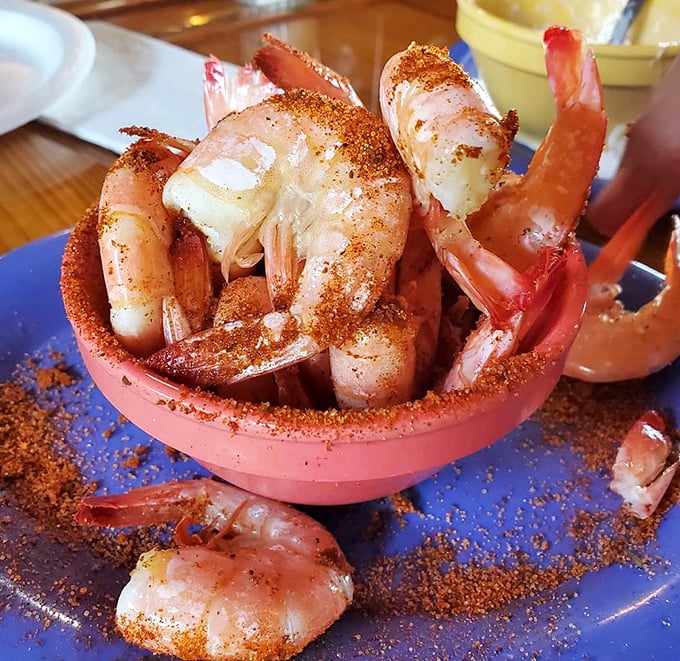 These spice-dusted shrimp aren't just seafood—they're little pink soldiers of flavor, reporting for delicious duty in their rosy bowl.