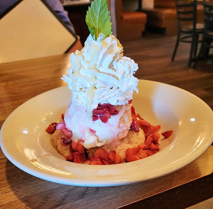 This strawberry shortcake doesn't just end your meal—it throws a tiny carnival on your taste buds. That mint leaf is basically wearing a tiny party hat.
