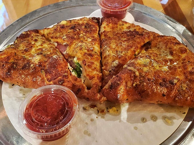 This stromboli isn't just a meal – it's an event. Golden-brown crust giving way to a molten interior of cheese and savory fillings. Napkins required, no sharing advised.