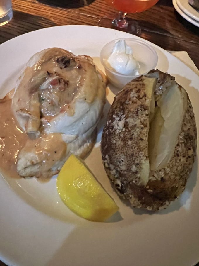 The stuffed flounder arrives looking like it's had a spa day in butter. That lemon wedge isn't garnish—it's the golden key to perfection.