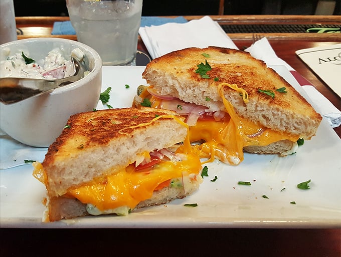 The stuffed grilled cheese elevates childhood nostalgia to art form – that perfect golden exterior giving way to a molten center that dreams are made of.