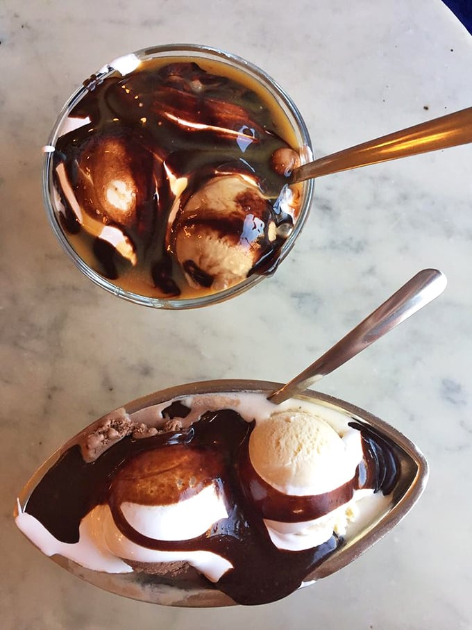 Hot fudge cascading over ice cream like chocolate lava. This sundae isn't just dessert—it's performance art with a deliciously sweet finale.