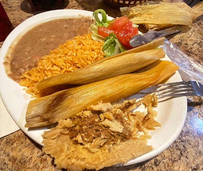 Tamales wrapped like precious gifts in corn husks. Unwrap to discover the tender masa treasure within – comfort food that transcends borders.