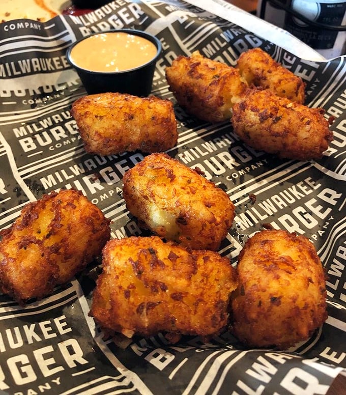 These aren't your average tater tots—they're golden-brown flavor grenades waiting to explode with cheesy goodness in your mouth.