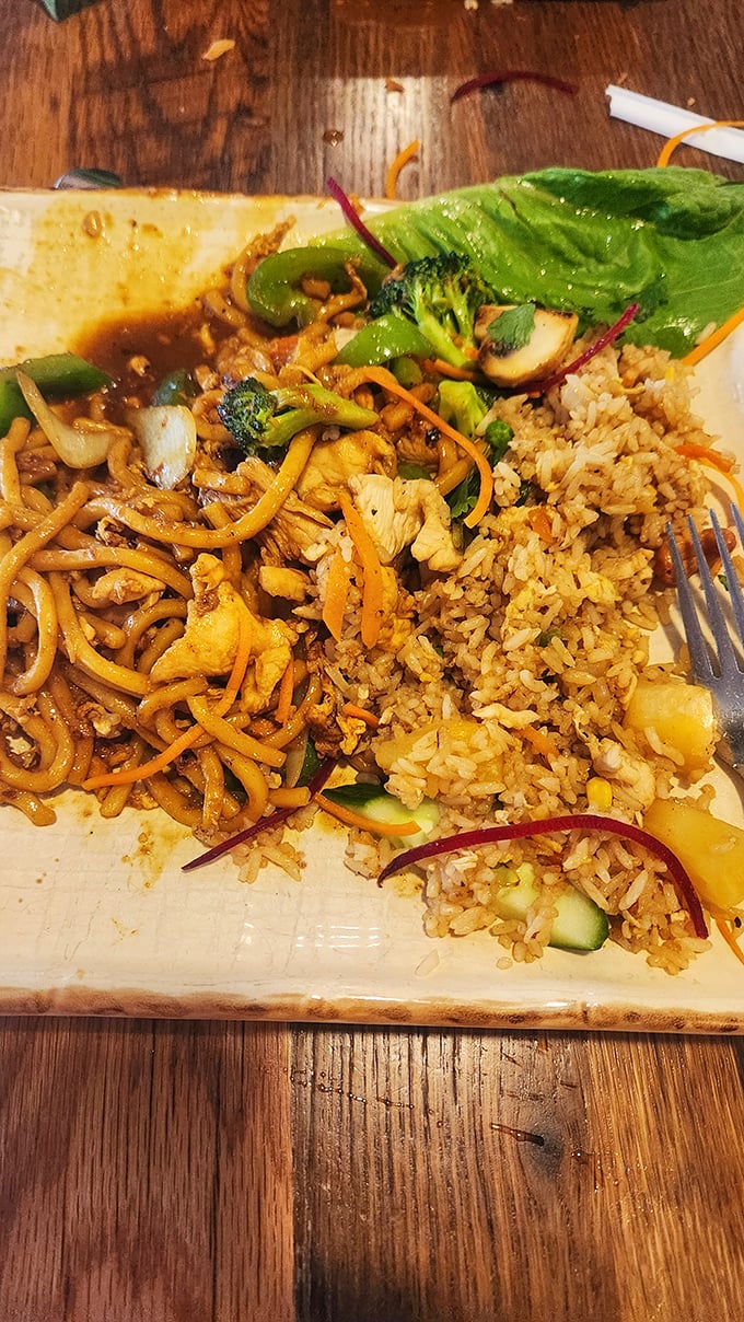 When noodles and rice share a plate, it's not carb overload—it's a textural symphony with vegetables playing supporting roles in perfect harmony.
