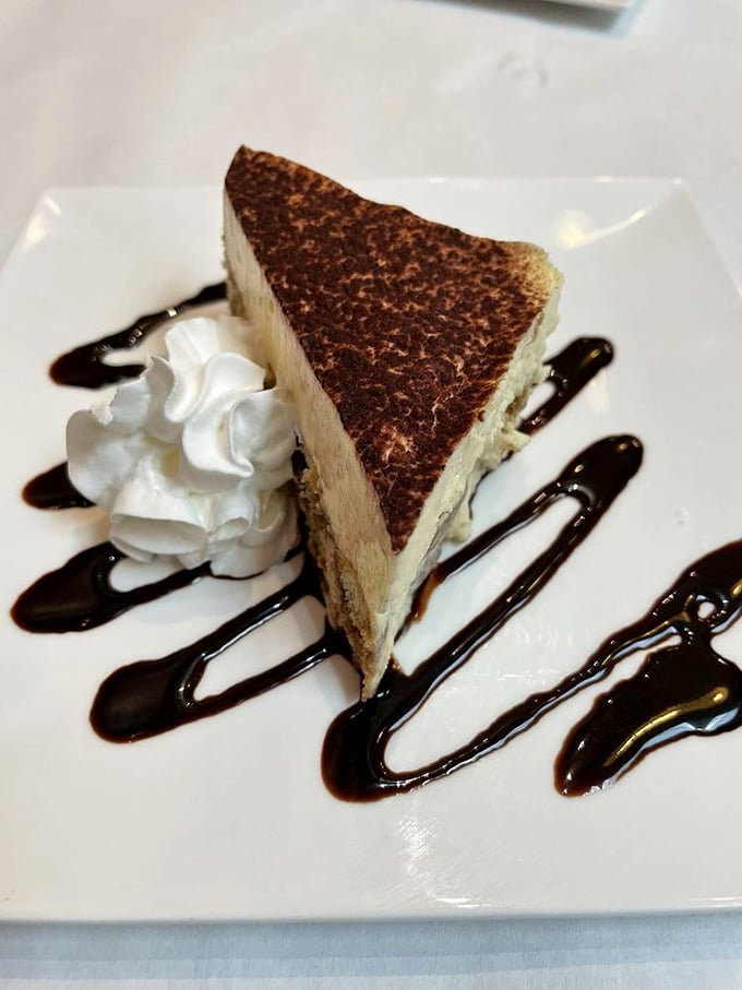 Tiramisu so authentic it should come with its own Italian passport. Coffee, mascarpone, and cocoa in perfect harmony—the dessert equivalent of Pavarotti.