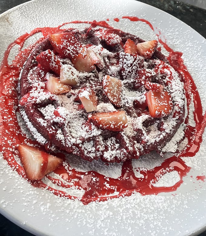 This red velvet waffle with fresh strawberries isn't scary at all—unless you count how frighteningly delicious it looks.