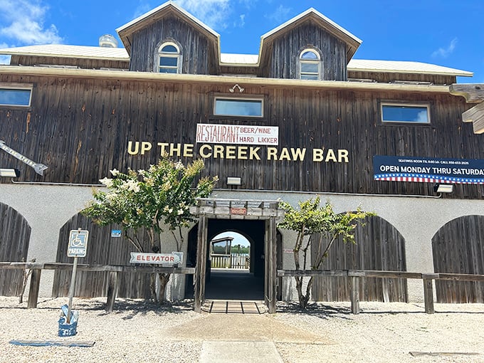 Up The Creek Raw Bar—where weathered wood, fresh seafood, and that archway entrance promise authentic Florida without even trying.
