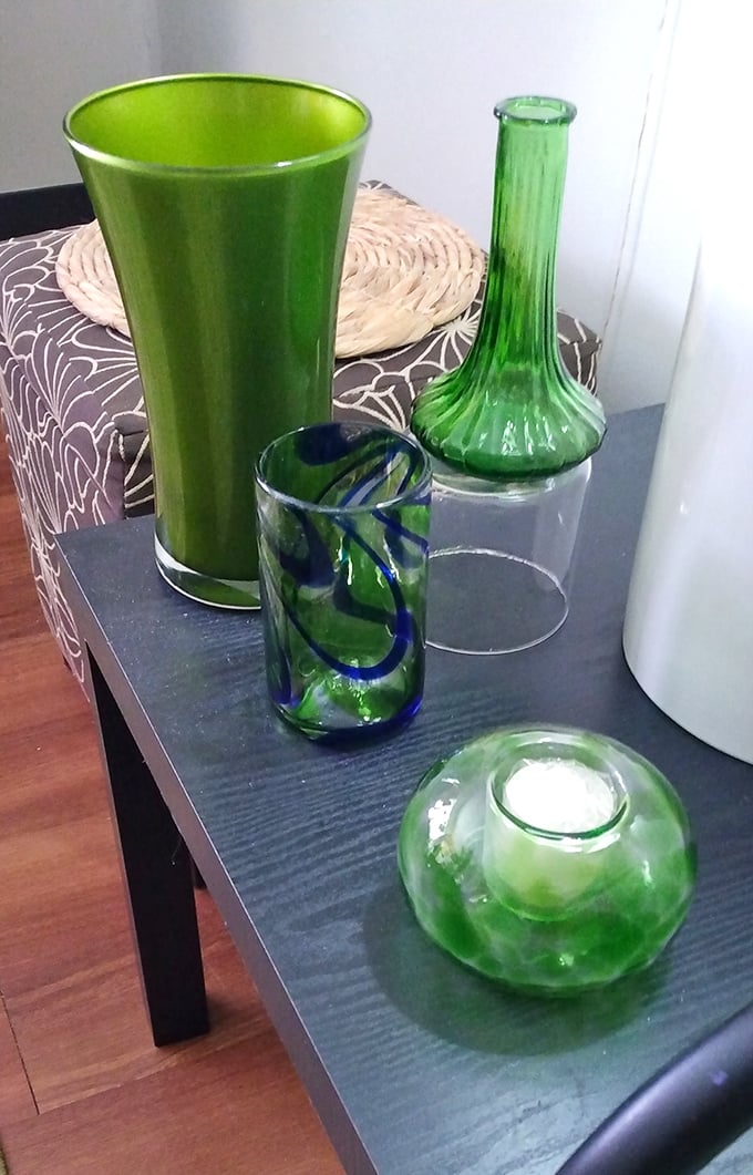 A collection of green glassware that would make your grandmother swoon. Mid-century modern meets contemporary chic on this unassuming display table.