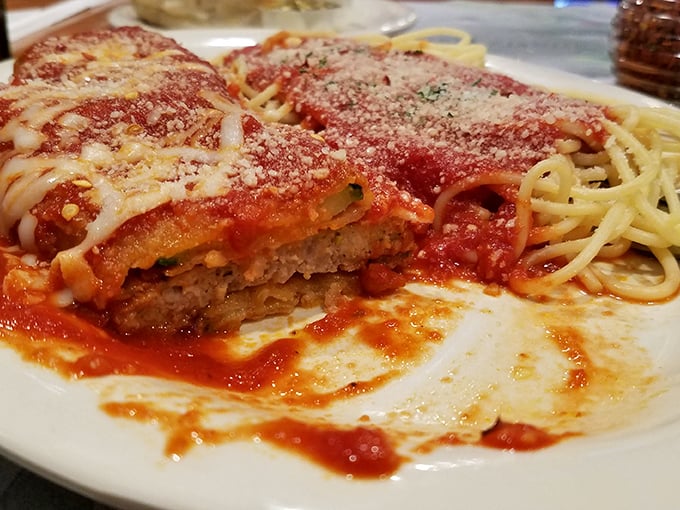 Veal parmesan that's seen more cheese than a Wisconsin dairy farm. The pasta alongside isn't just a side – it's a worthy companion.