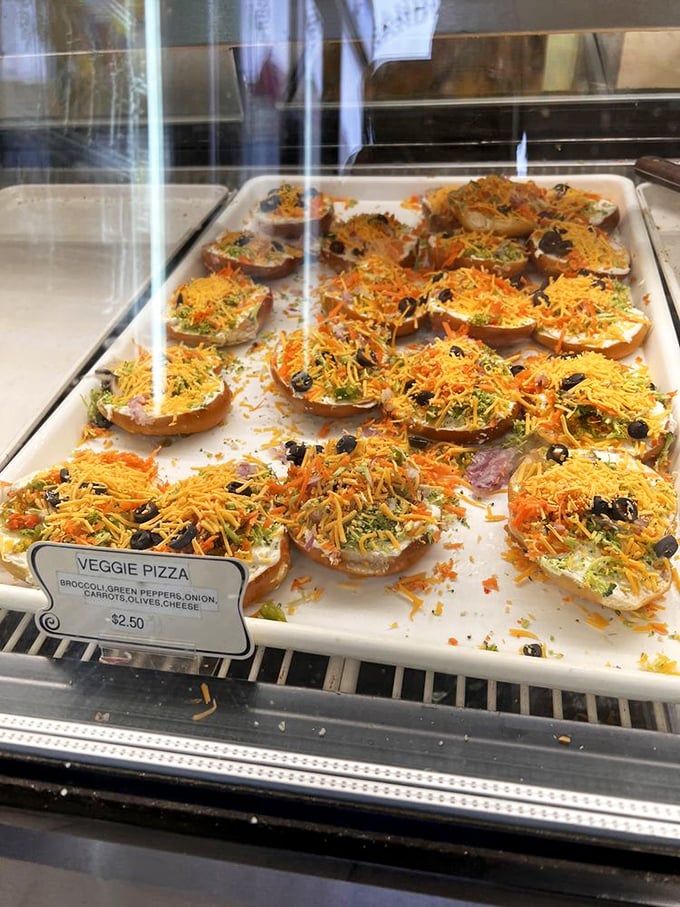 Veggie pizza reimagined—open-faced pretzel rounds topped with a rainbow of vegetables and cheese that would make even carnivores consider conversion.