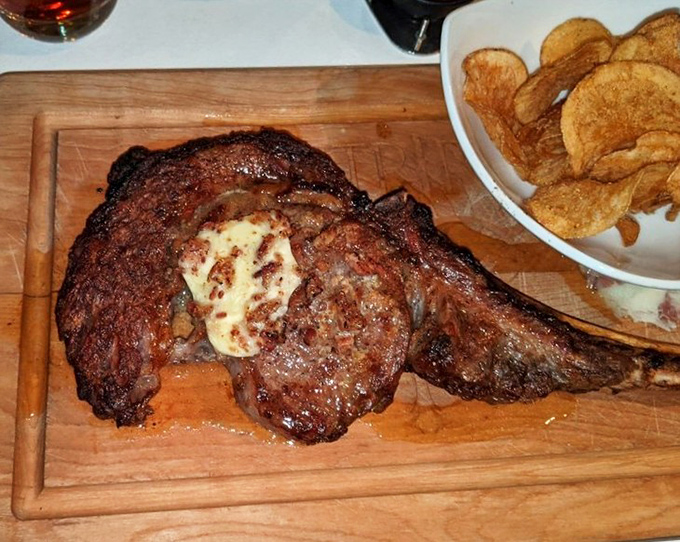 This isn't just a steak—it's a primal experience on a wooden board, with butter melting like a summer romance on top.