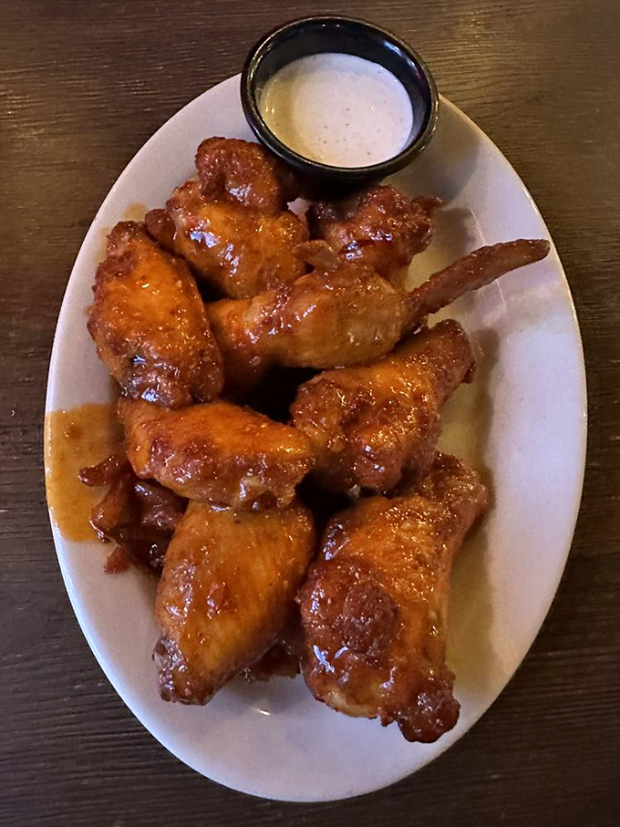 Buffalo wings that strike the perfect balance between heat and sweet, with a dipping sauce worth bottling and taking home.