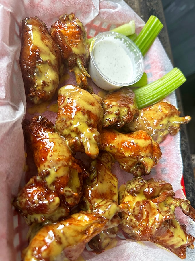 These wings aren't just glazed – they're lacquered with flavor. The celery sticks are merely suggested vegetables to ease your conscience.